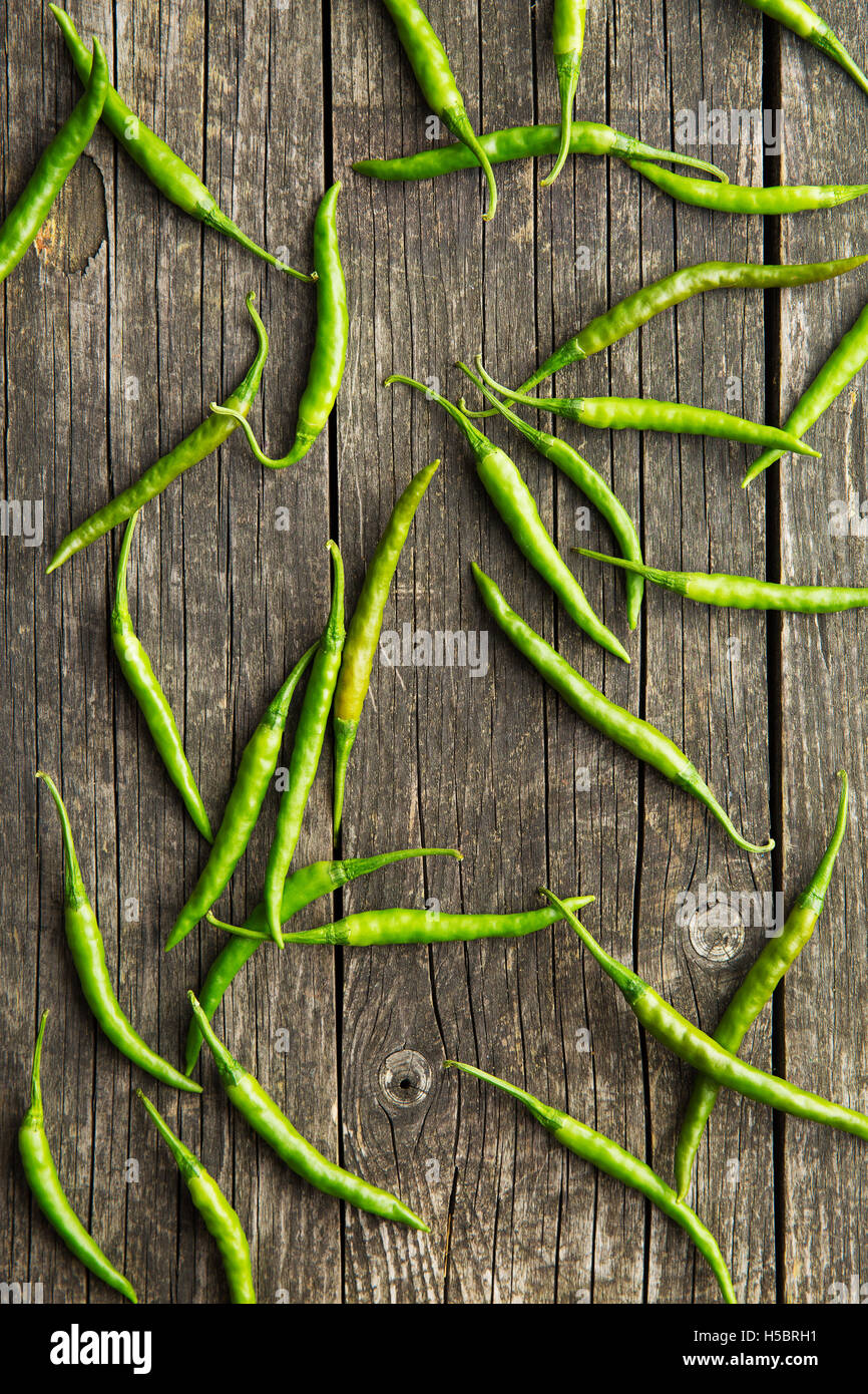 Green chili peppers. Top view Stock Photo - Alamy