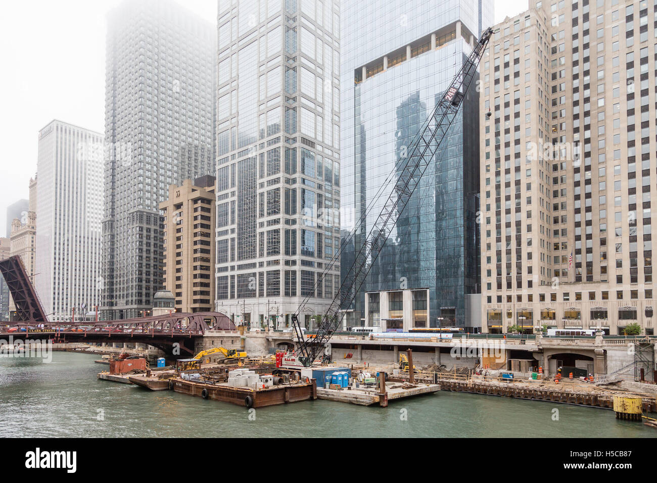 Construction Barges on Chicago River by skyscrapers Stock Photo - Alamy