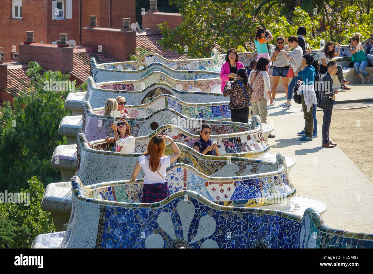 Typical Gaudi style mosaic benches at Park Guell in Barcelona Stock ...