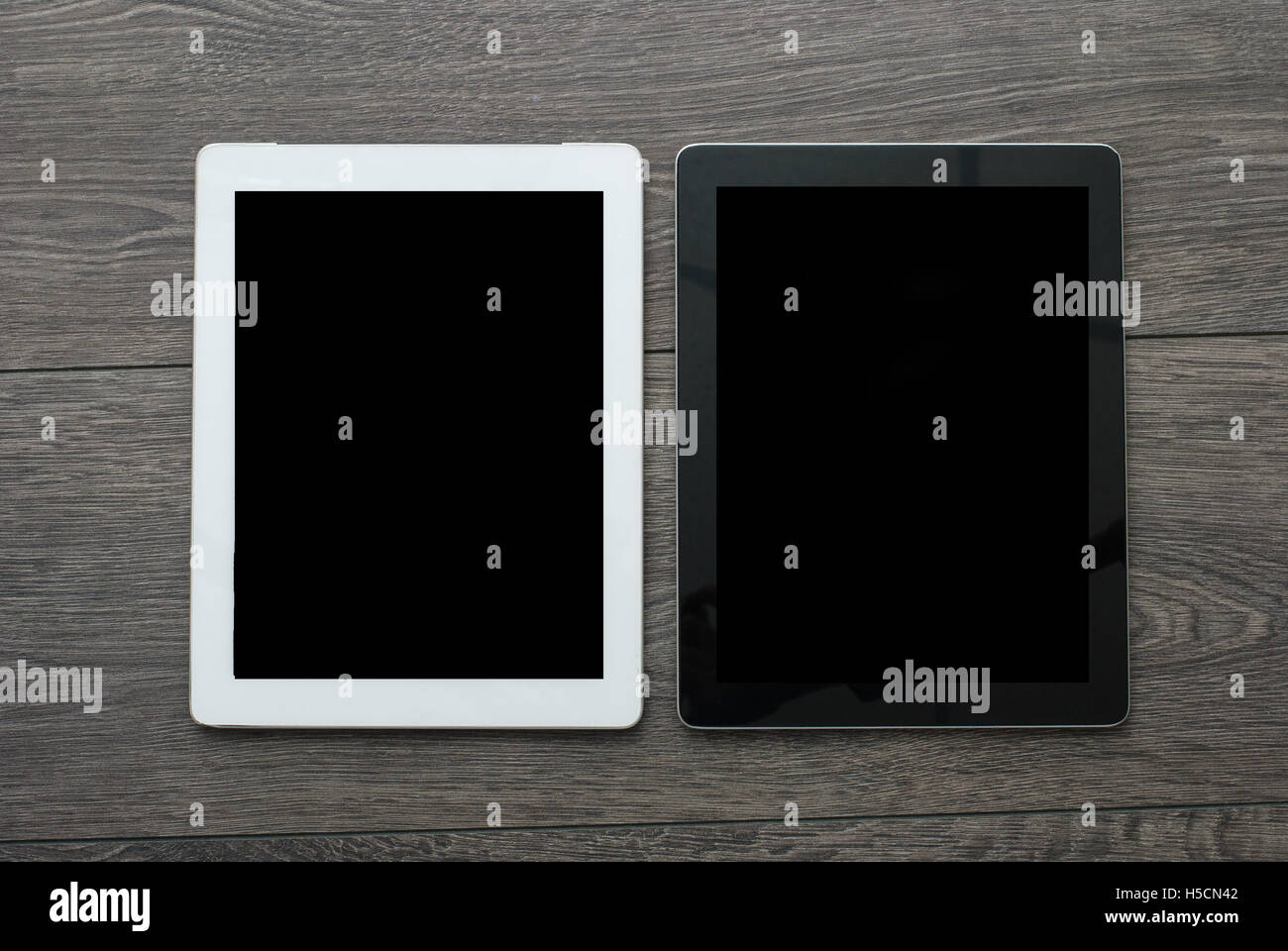 Tablet computer on boards. White screen. Top view Stock Photo - Alamy