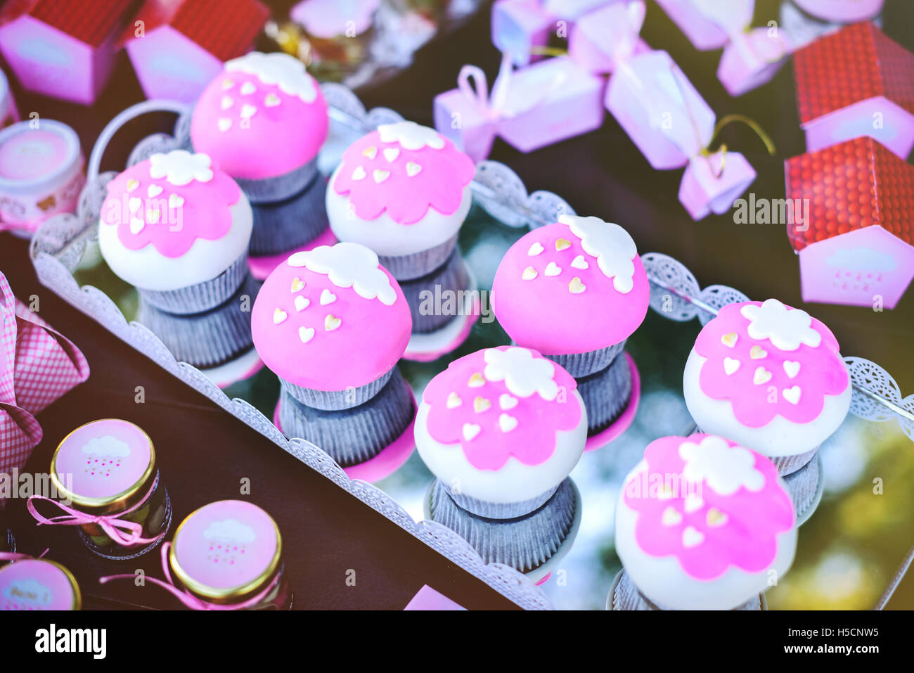 Dessert table at kids birthday party. Cake, candies, marshmallows ...