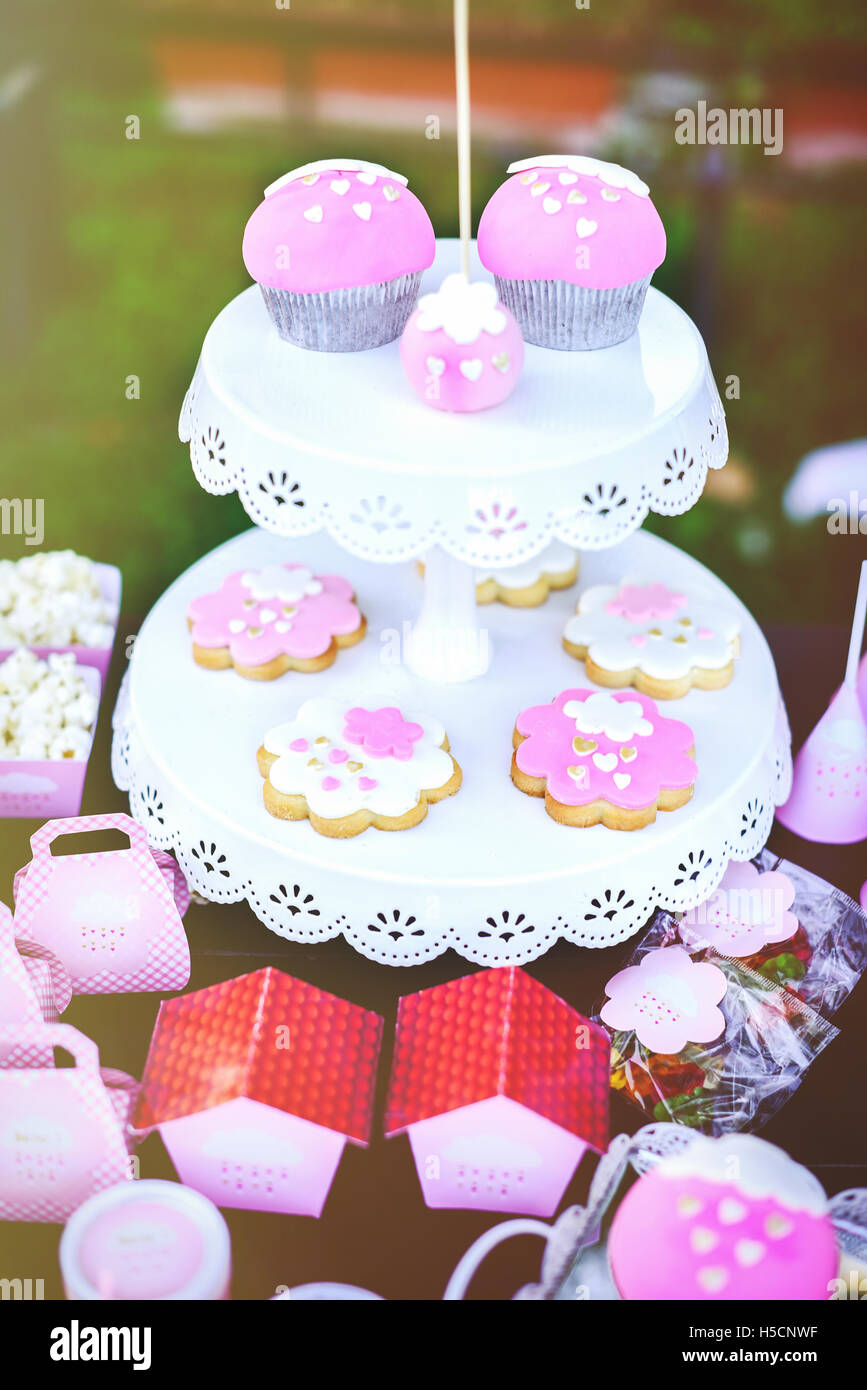 Dessert table at kids birthday party. Cake, candies, marshmallows ...