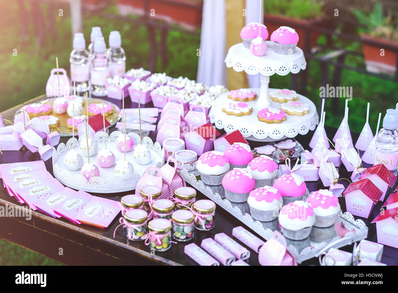Dessert table at kids birthday party. Cake, candies, marshmallows ...