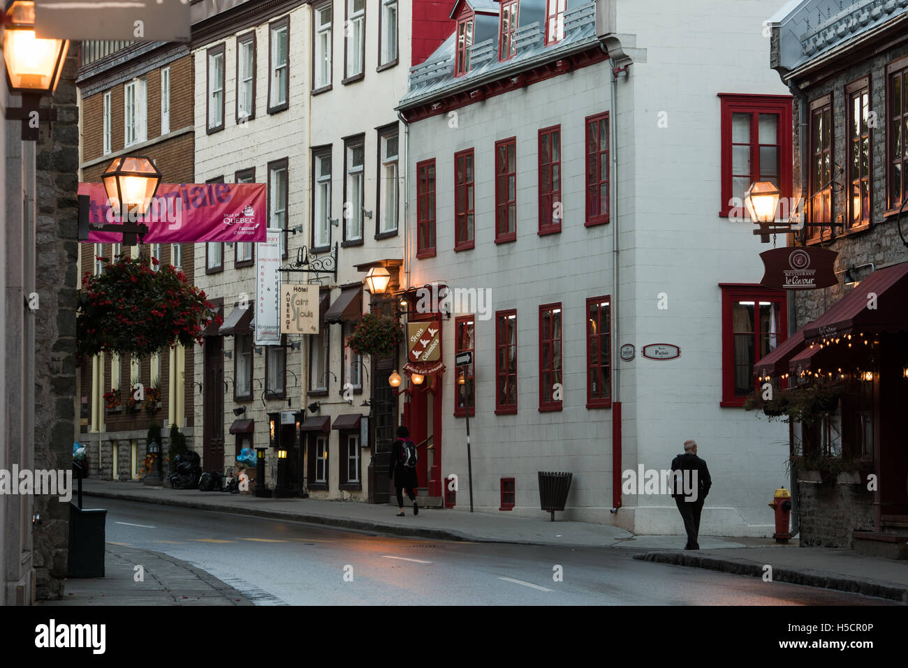 Person walking in old Quebec City Stock Photo - Alamy