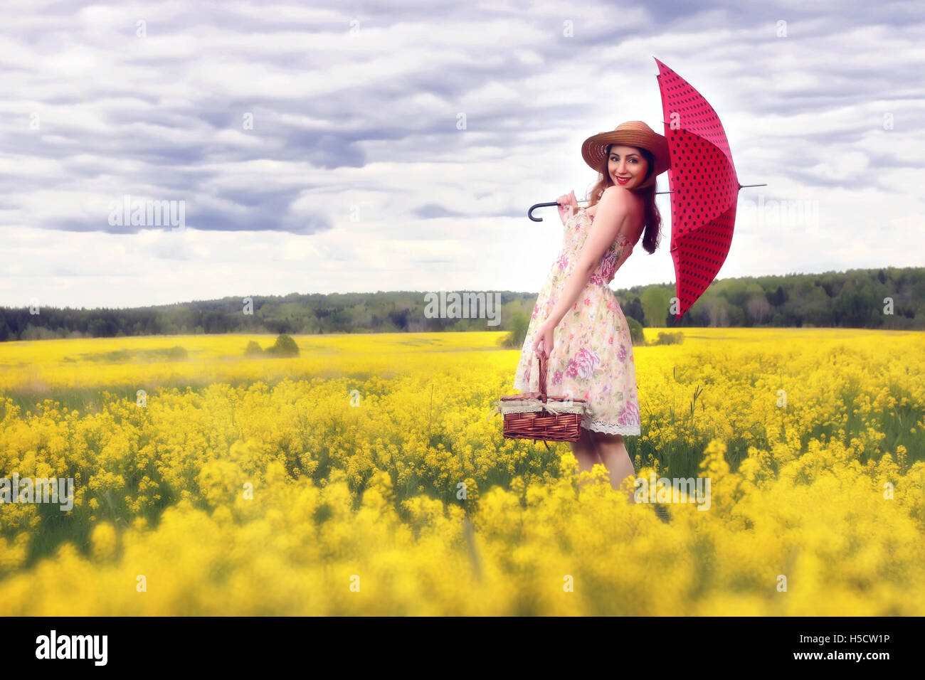 girl in a field of flowers umbrella Stock Photo - Alamy