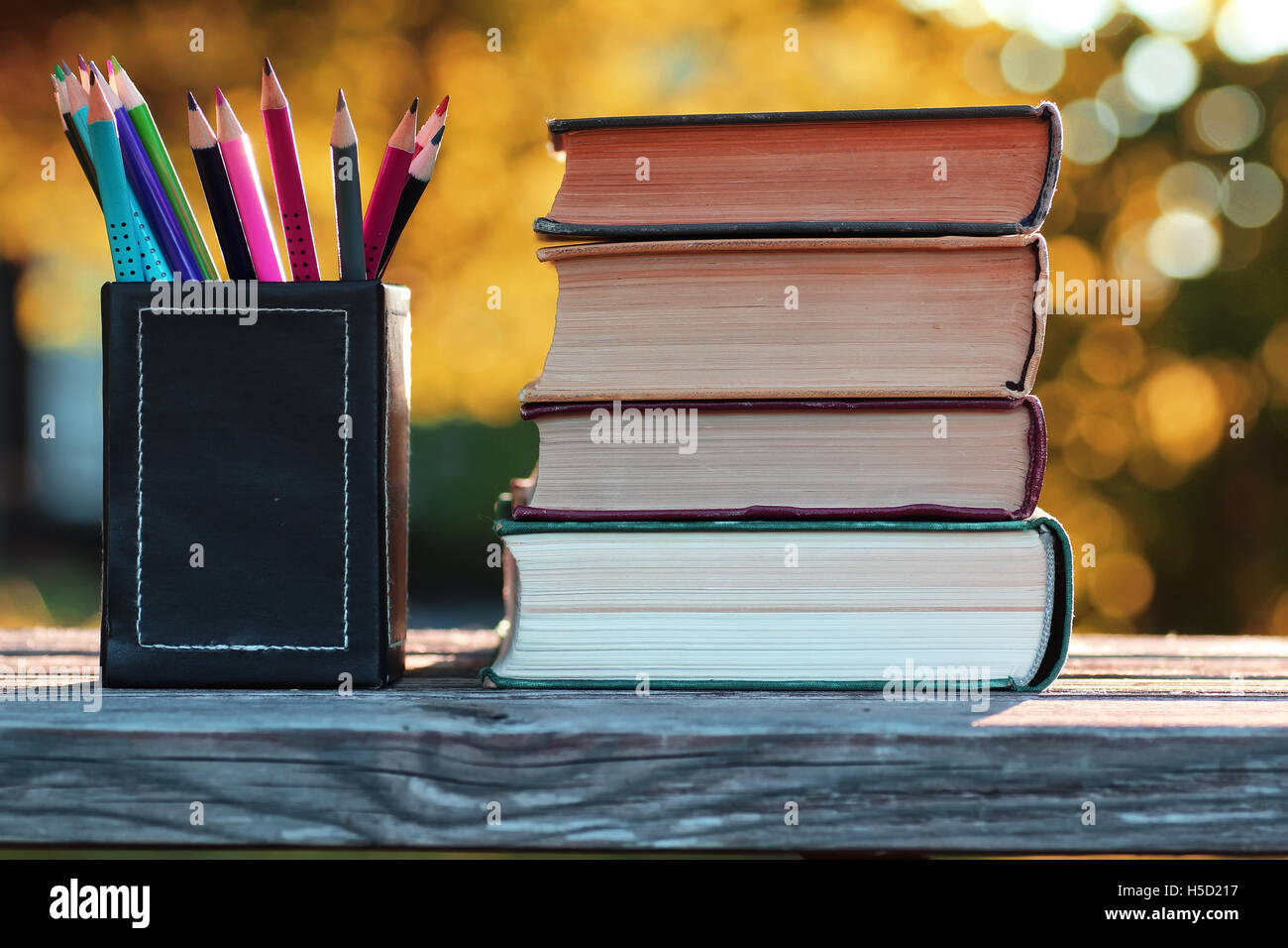 autumn book stack wooden outdoor Stock Photo - Alamy