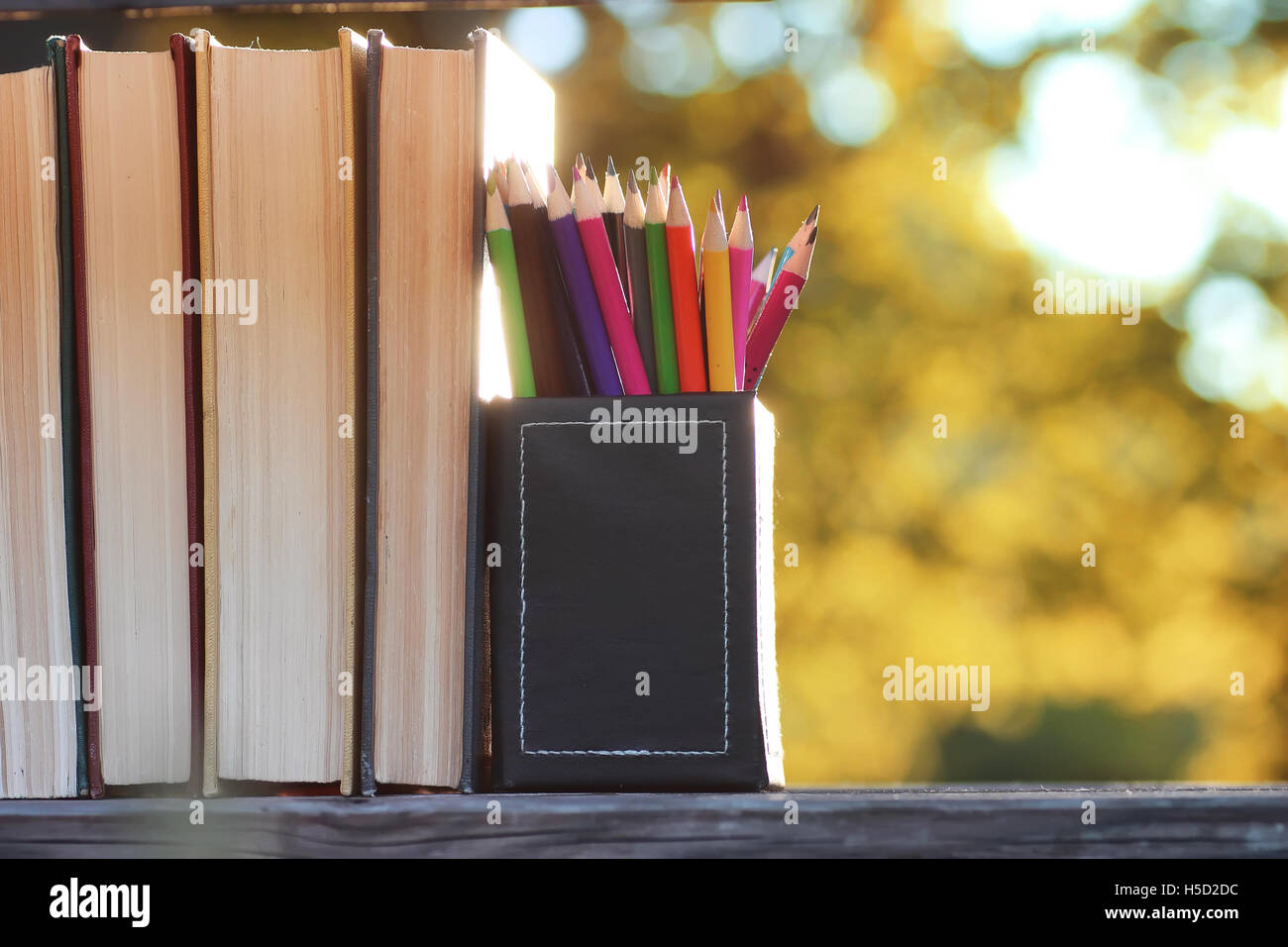 autumn book stack wooden outdoor Stock Photo - Alamy