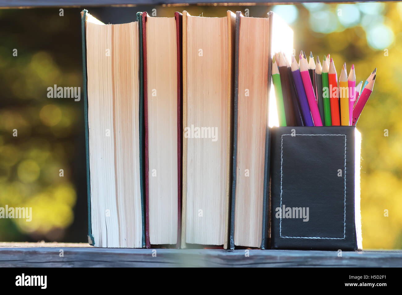 autumn book stack wooden outdoor Stock Photo - Alamy
