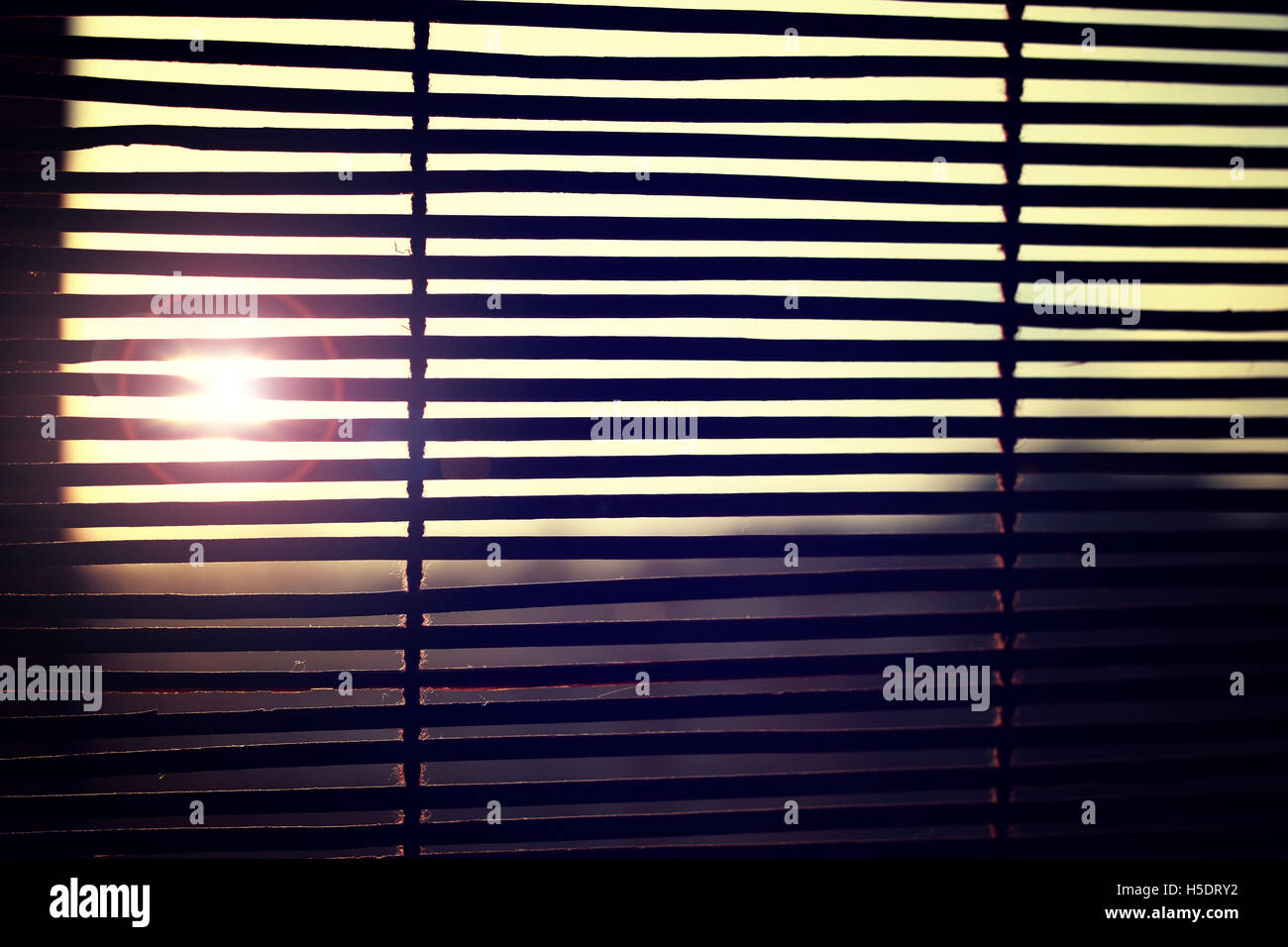 the sun is shining through the blinds Stock Photo - Alamy