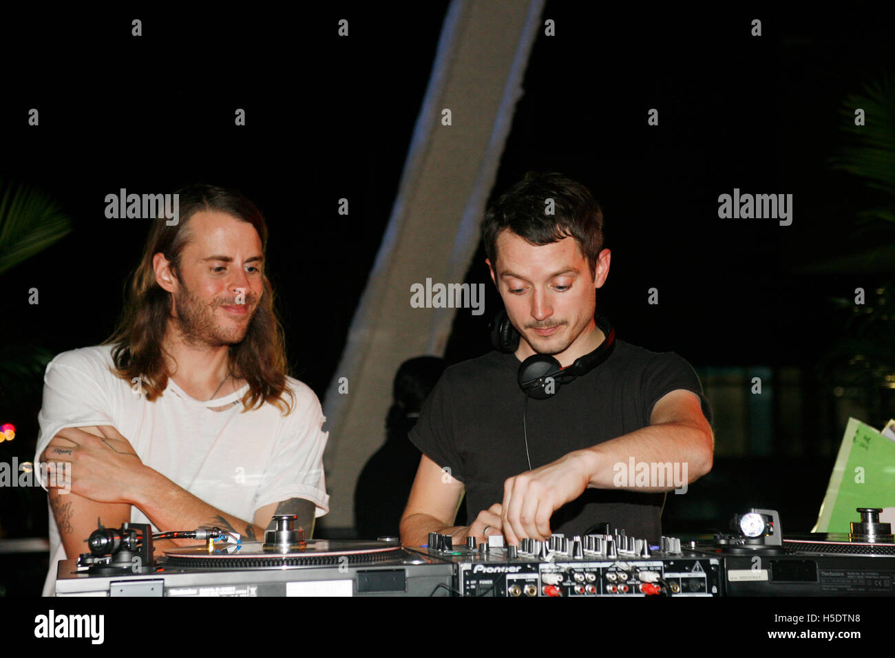Actor Elijah Wood (r) and Zach Cowie djing at Illuminate The Night at ...