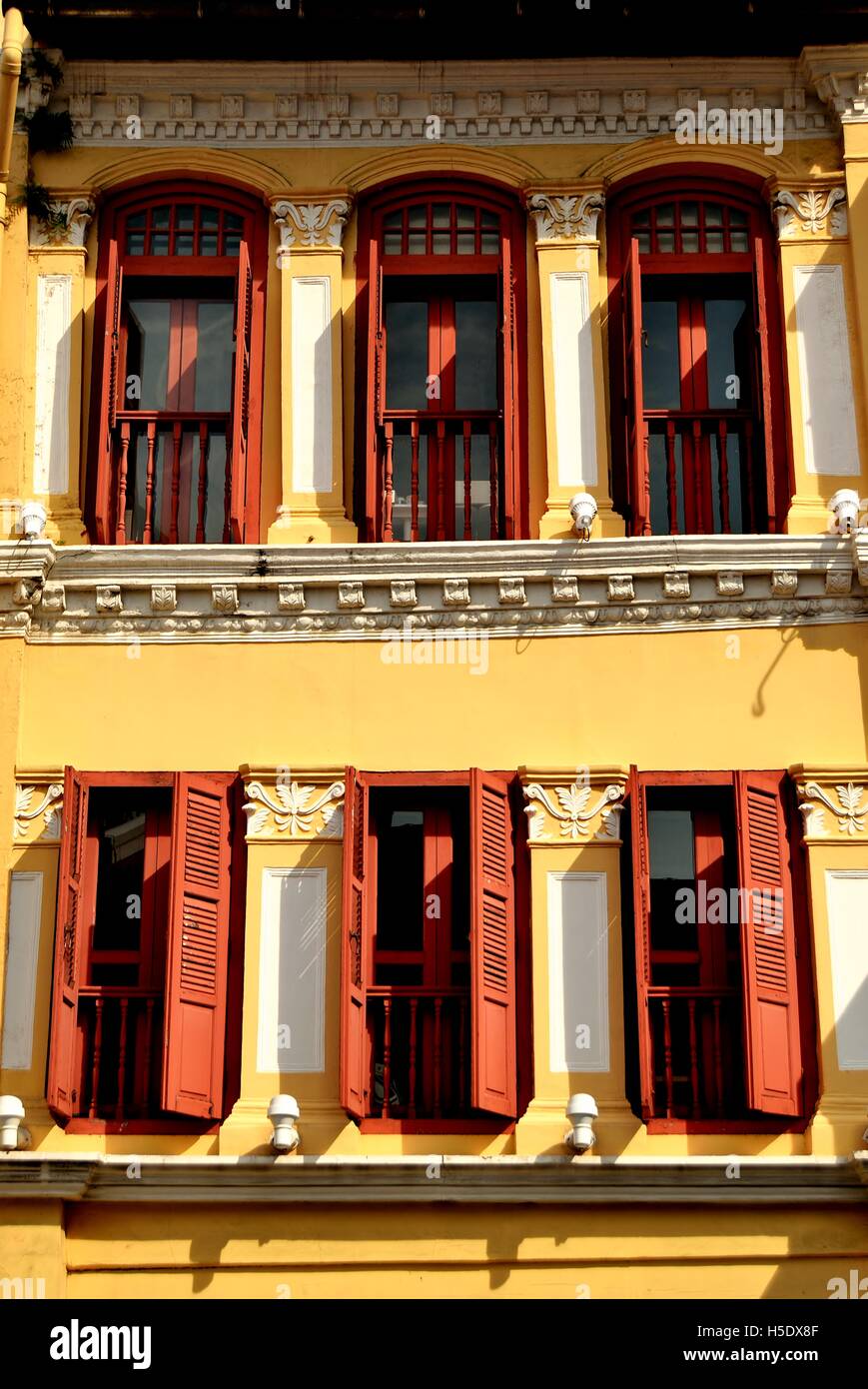 Singapore - restored ornate shop house with rust shutters in Chinatown ...