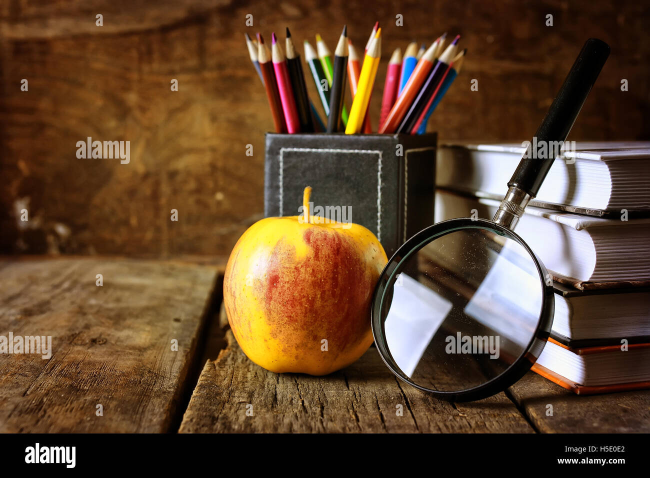 magnifying glass education book Stock Photo - Alamy