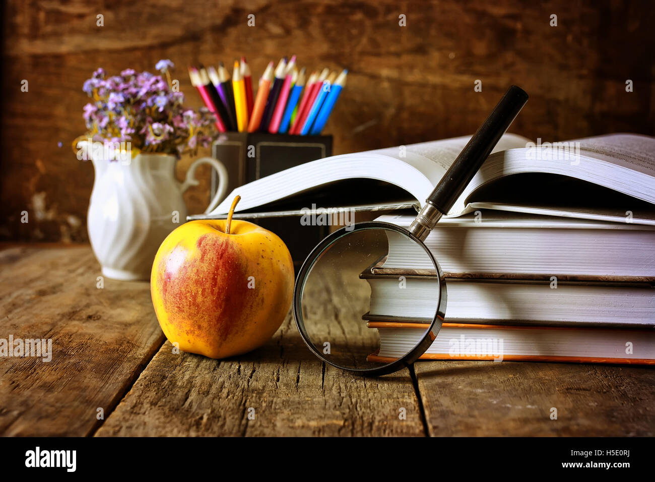 magnifying glass education book Stock Photo - Alamy