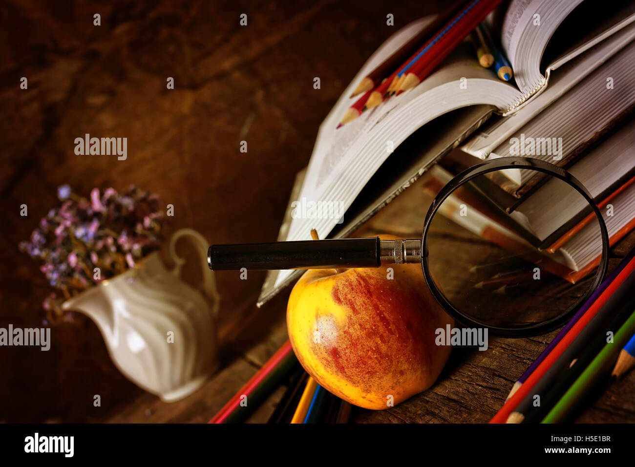 magnifying glass education book Stock Photo - Alamy