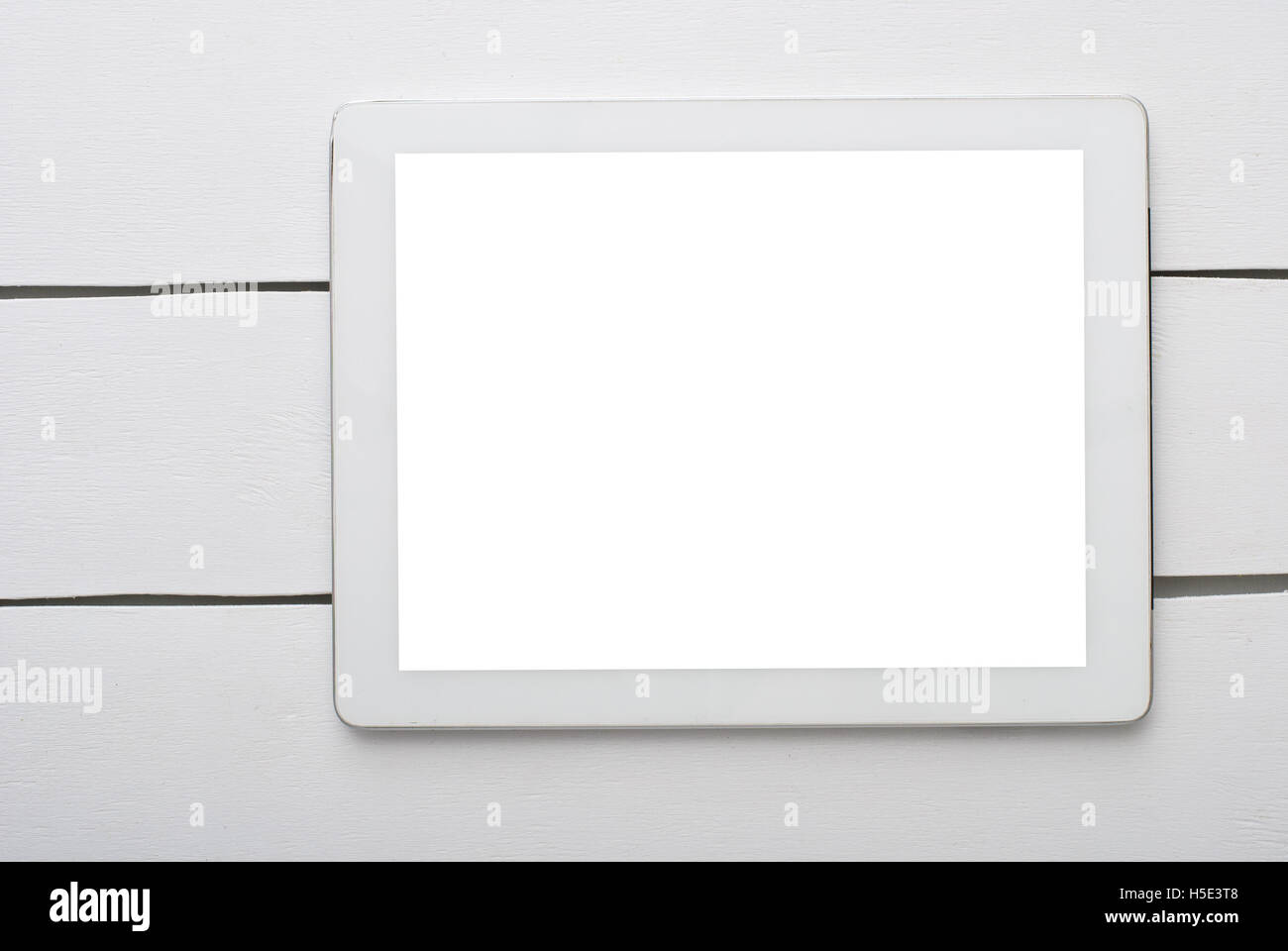 Tablet computer on boards. White screen. Top view Stock Photo - Alamy