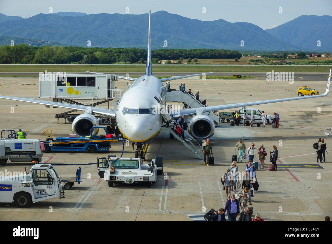 Travel by plane - people alight from aircraft at destination Stock ...