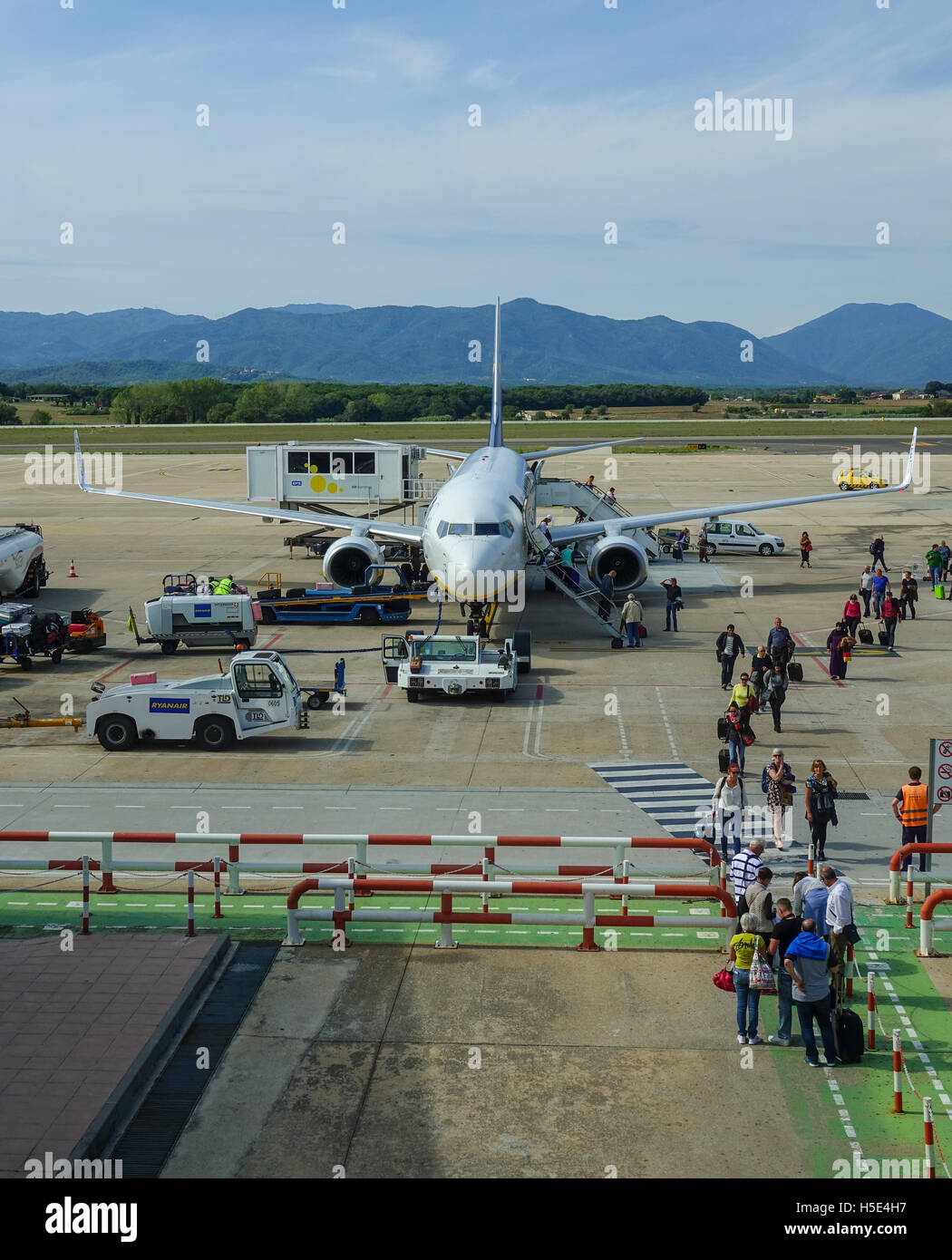 Deboarding passengers at the airport Stock Photo - Alamy