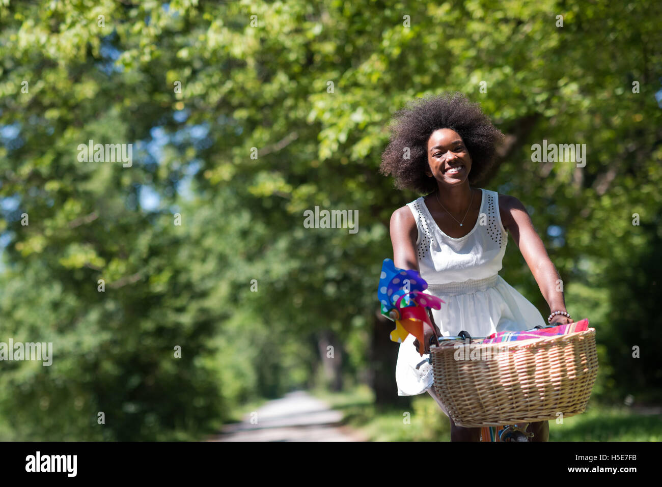 beautiful young African American women enjoy while riding a bicycle in ...