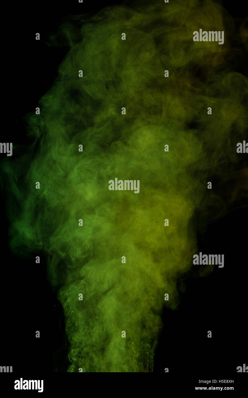 Abstract green yellow water vapor on a black background. Texture ...