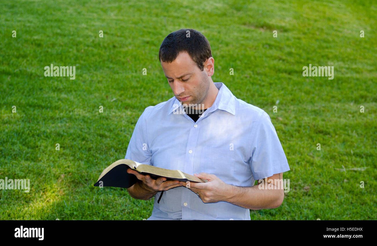 Man reading holy bible hi-res stock photography and images - Alamy