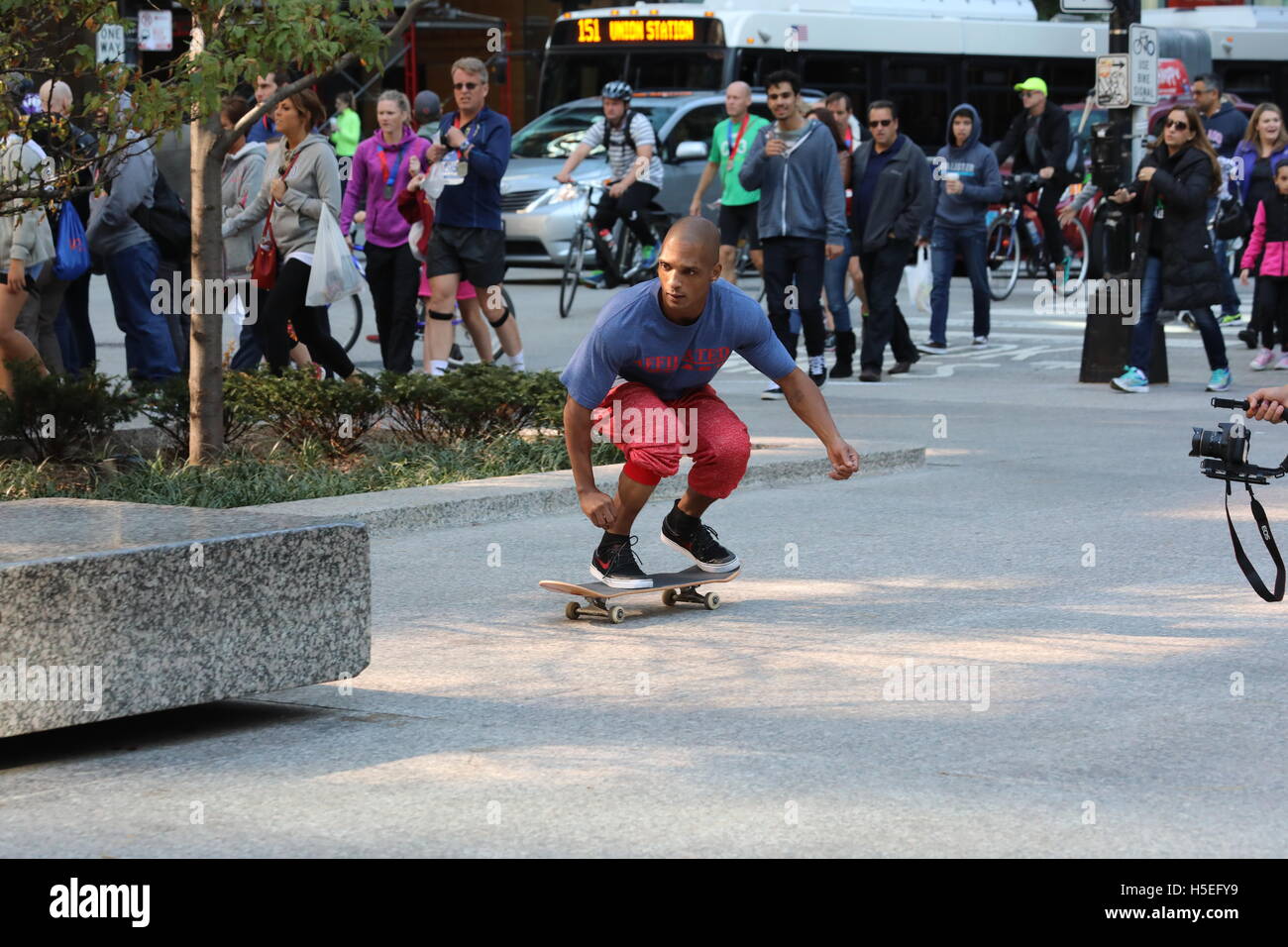 Filming man on a skateboard Stock Photo - Alamy