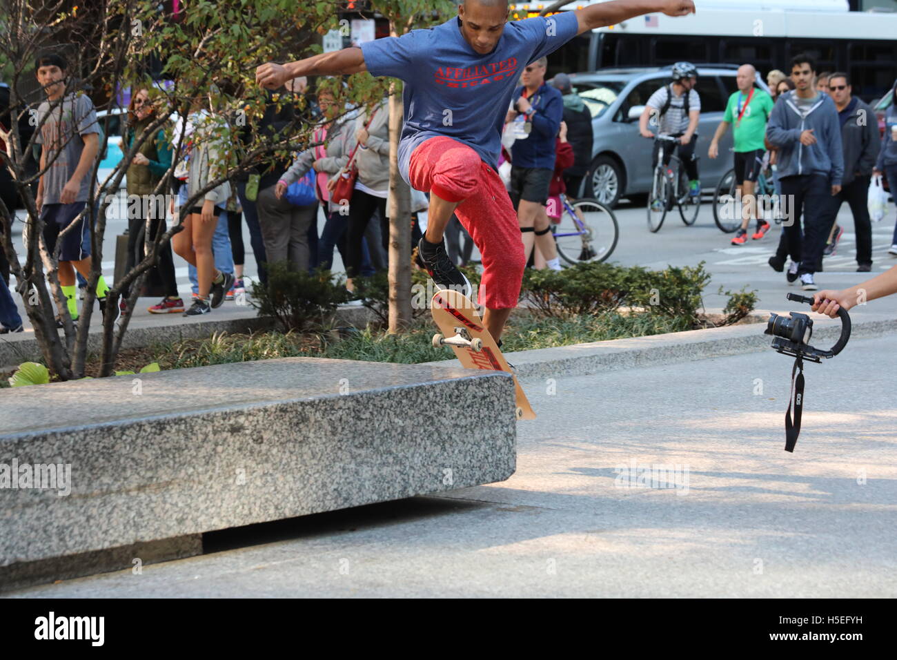 Filming man on a skateboard Stock Photo - Alamy