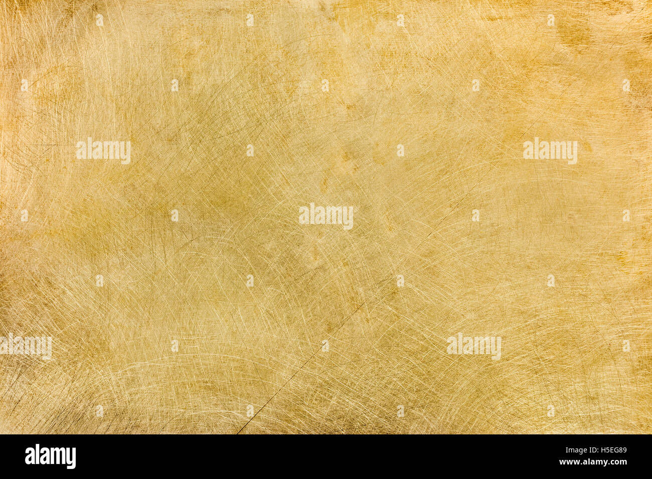 industrial brushed brass plate with multiple scratches textured ...