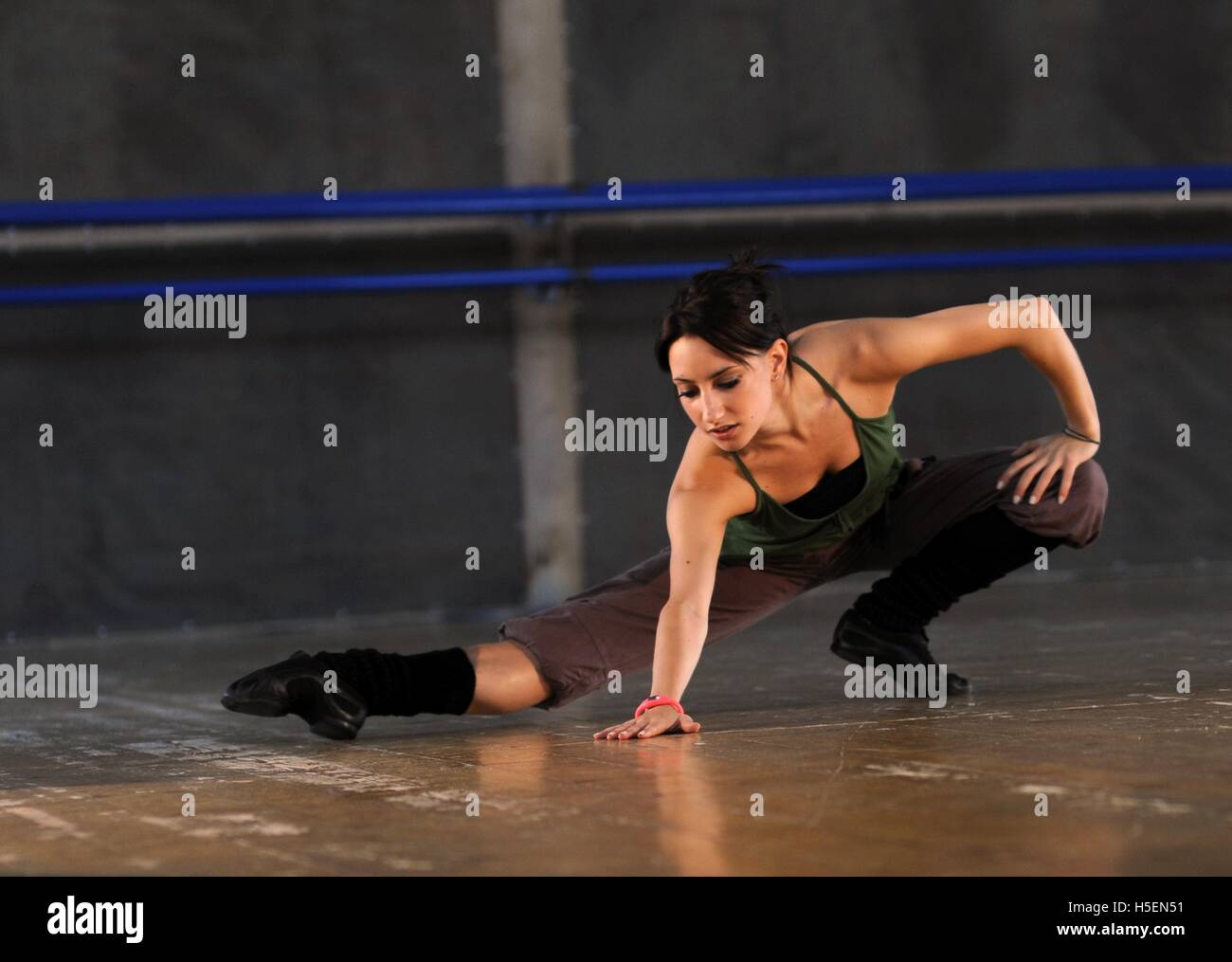 Sporty dancer girl dance, working out, doing fitness exercises with ...