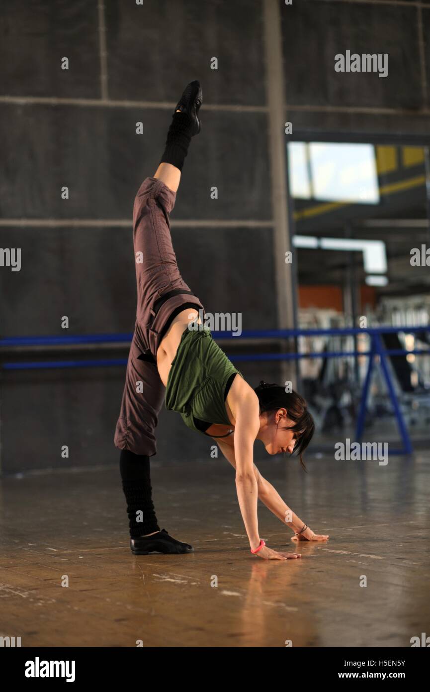 Sporty dancer girl dance, working out, doing fitness exercises with ...