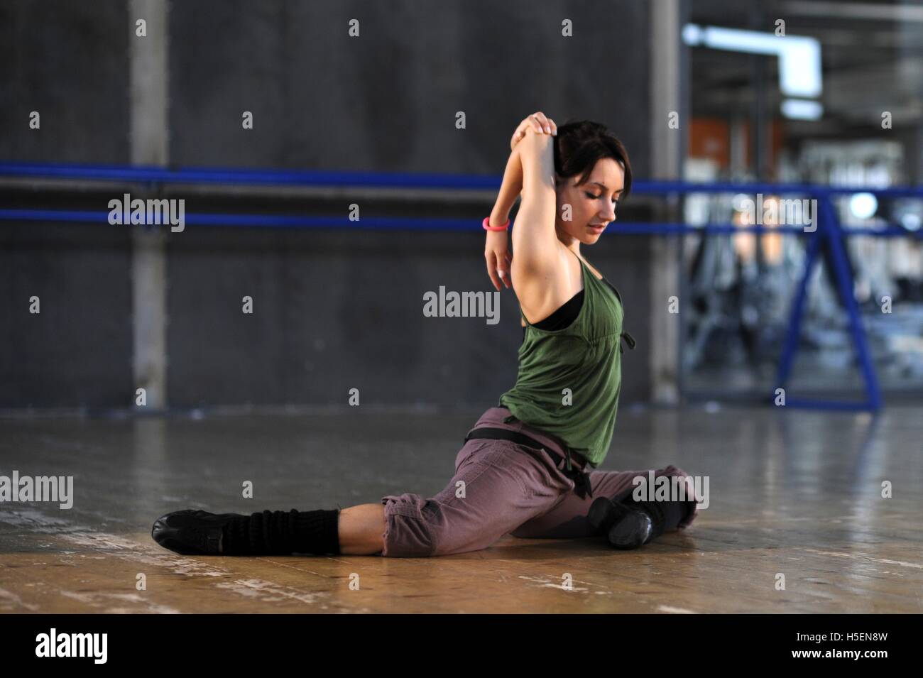 Sporty dancer girl dance, working out, doing fitness exercises with ...