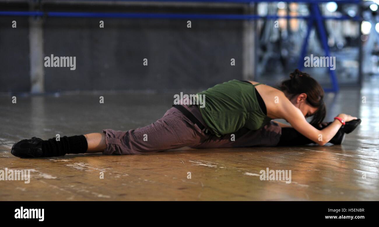 Sporty dancer girl dance, working out, doing fitness exercises with ...