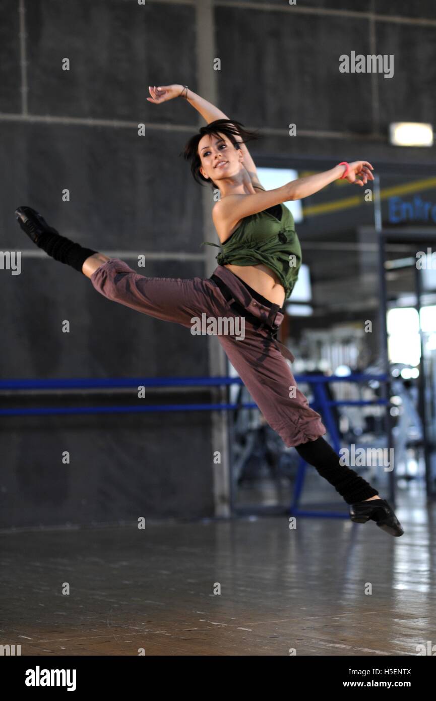 Sporty dancer girl dance, working out, doing fitness exercises with ...