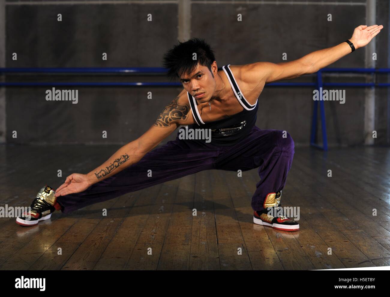 Asian man does fitness in the gym and Kung fu stick fighter Stock Photo ...