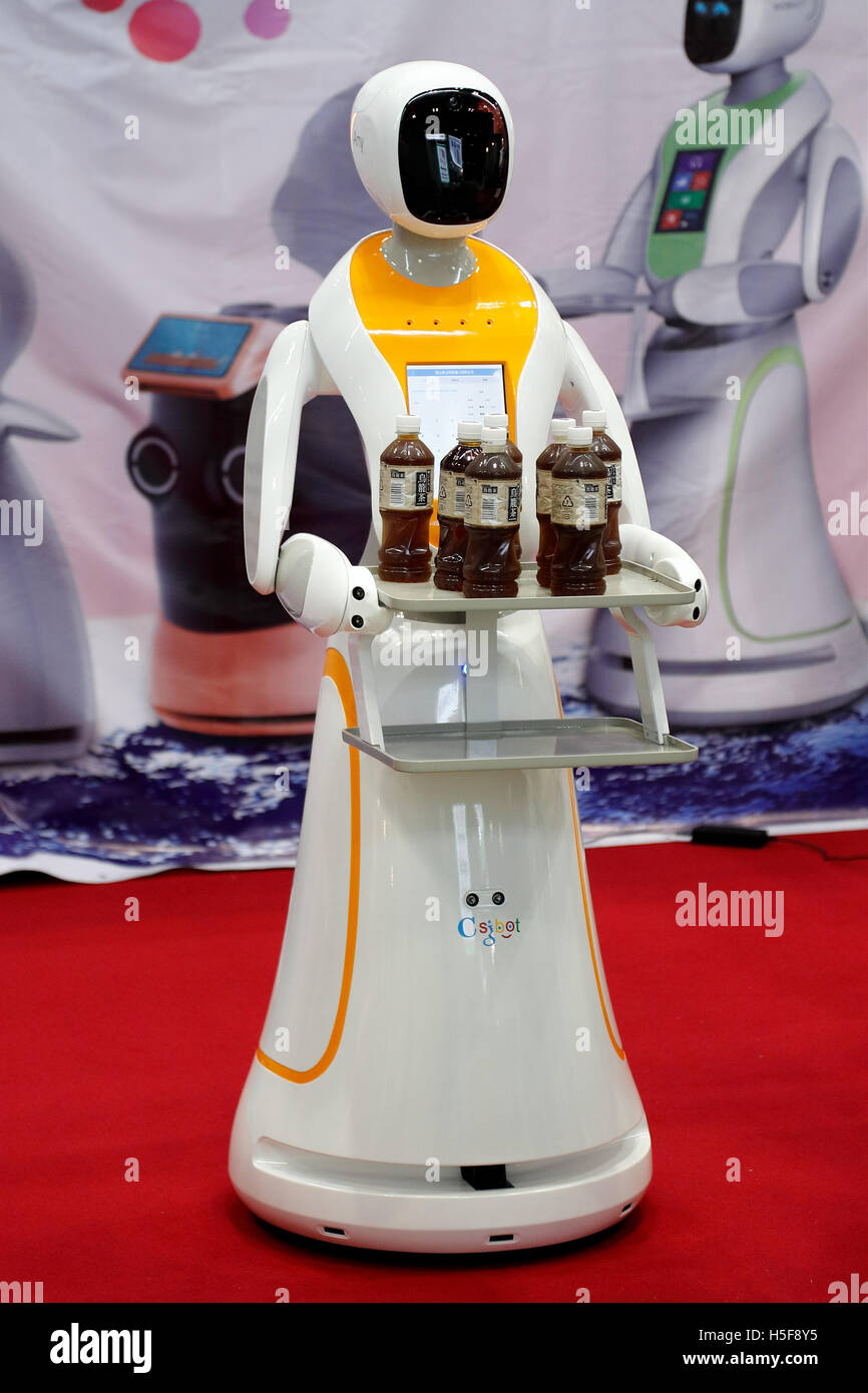 A robot waiter offers drinks to visitors during the Japan Robot Week 2016 in Tokyo Big Sight on ...