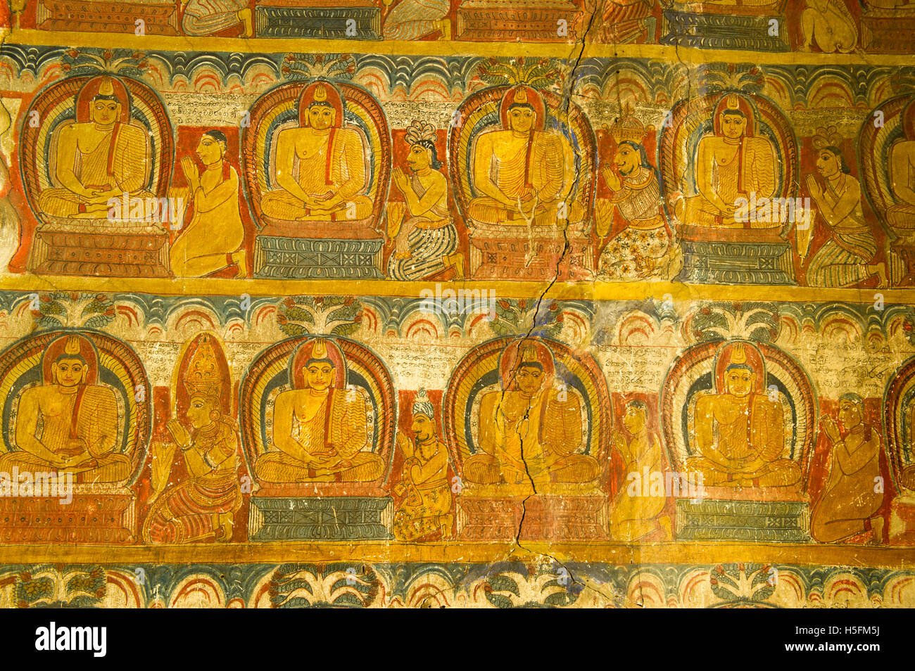 Interior of an ancient cave temple with Dambulla style paintings ...