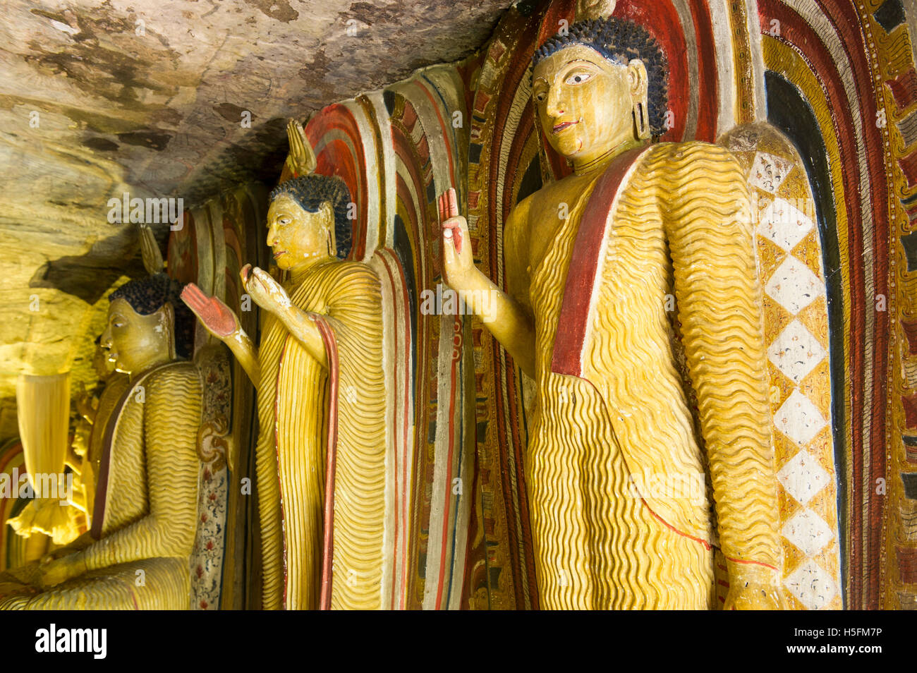 Interior of an ancient cave temple with Dambulla style paintings ...