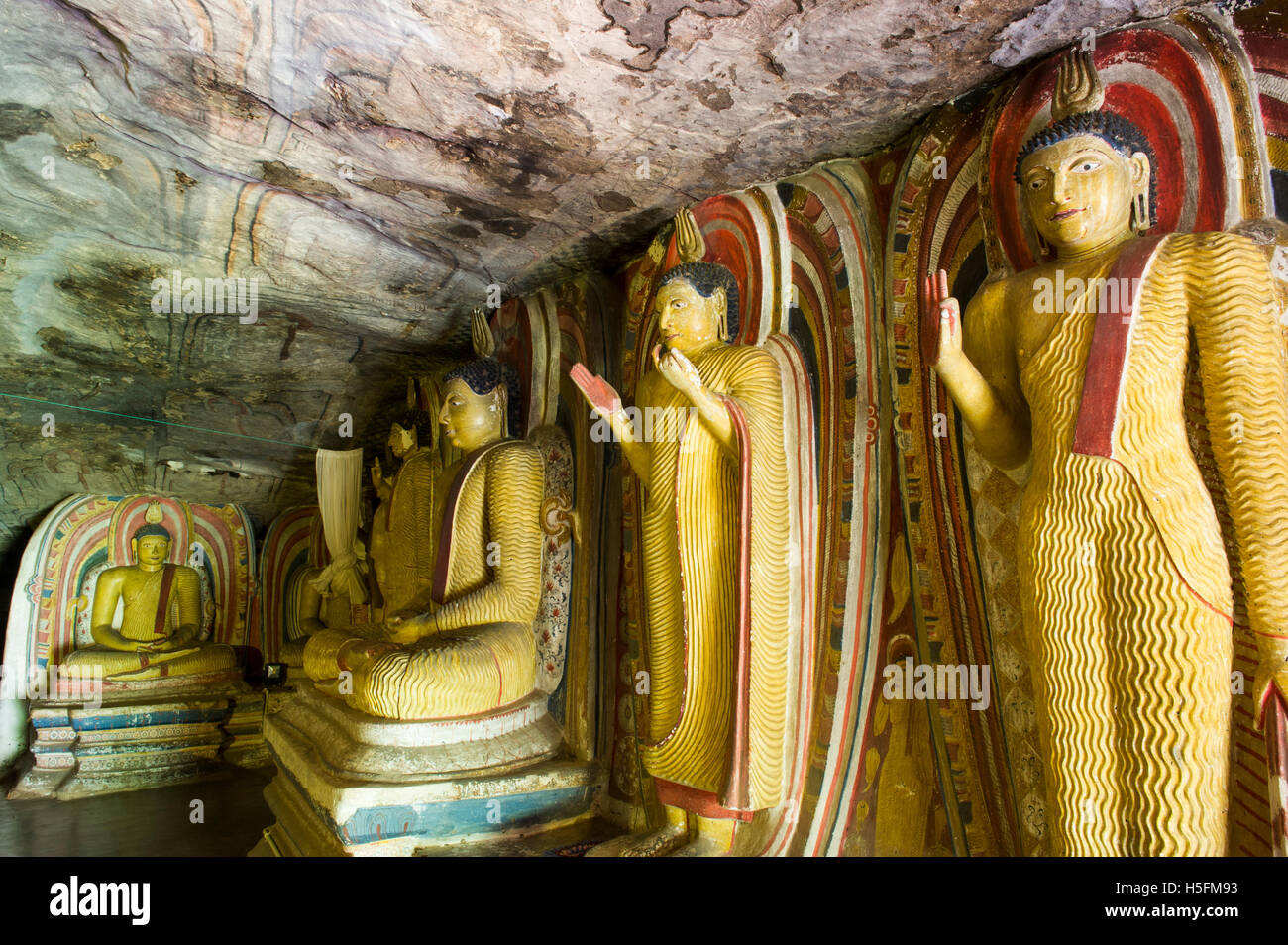 Interior of an ancient cave temple with Dambulla style paintings ...