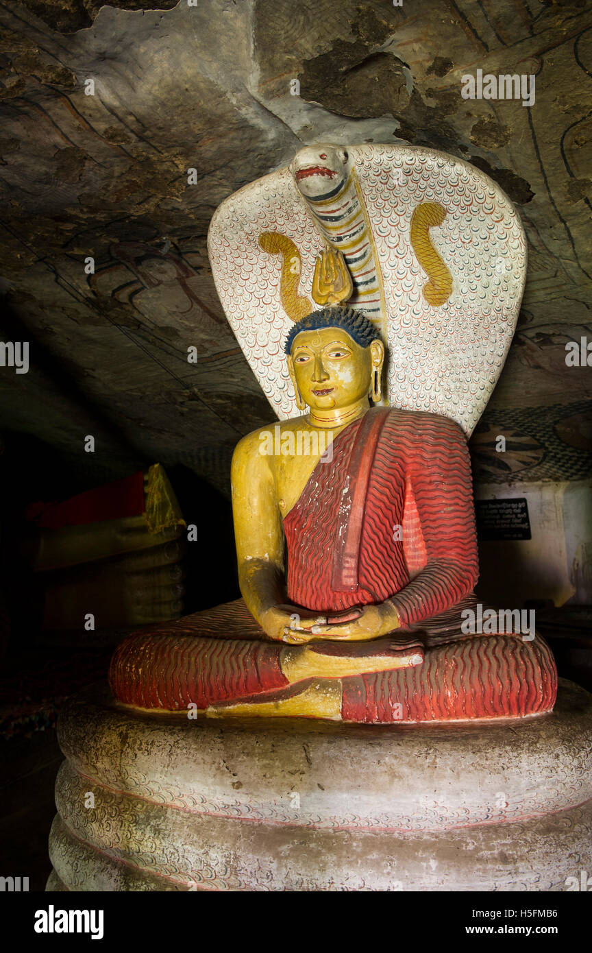 Interior of an ancient cave temple with Dambulla style paintings ...