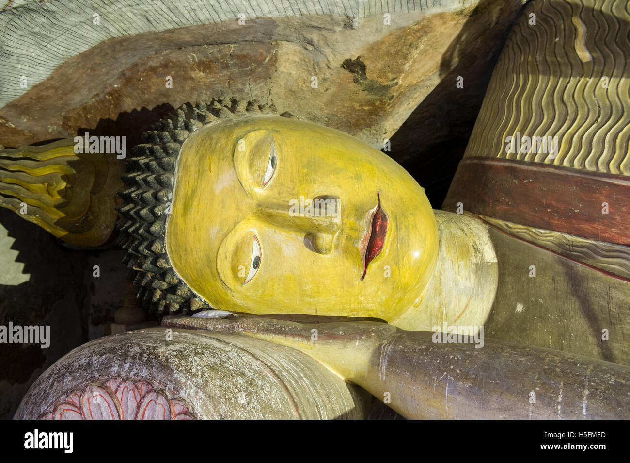 Interior of an ancient cave temple with Dambulla style paintings ...