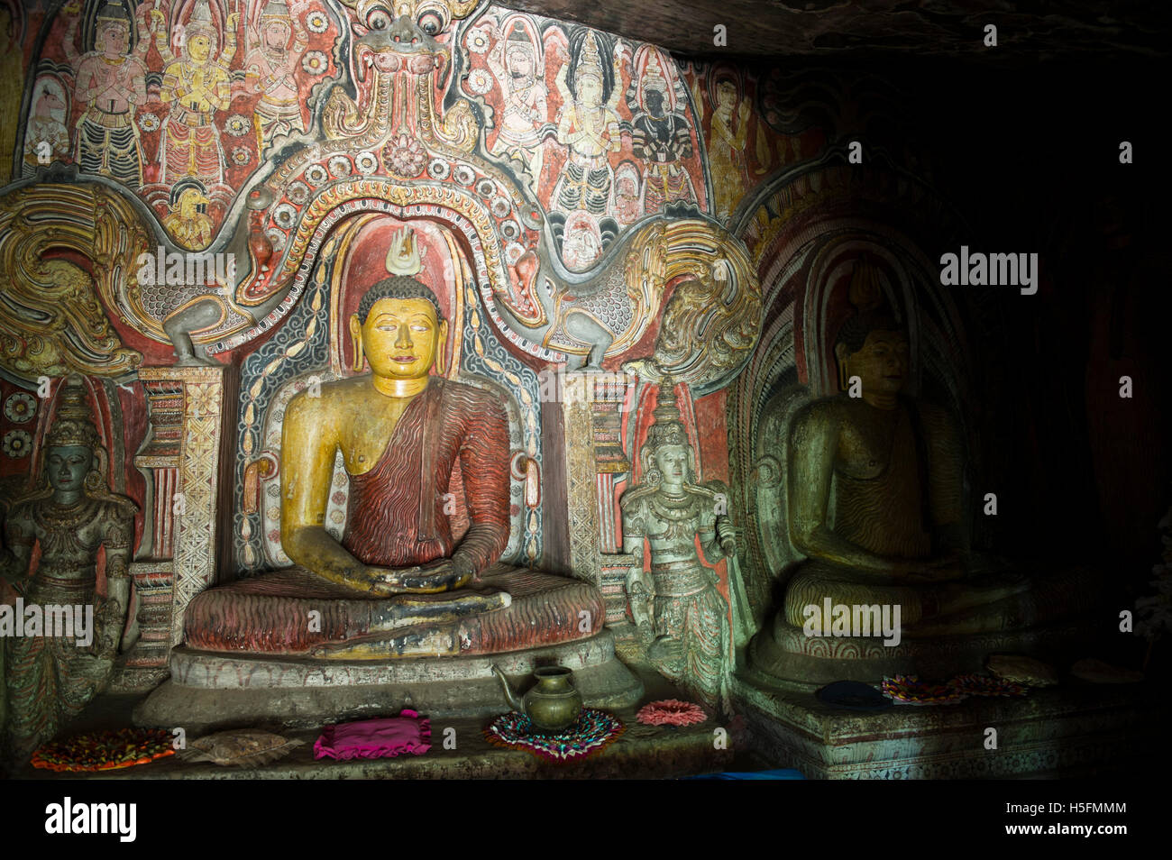Interior of an ancient cave temple with Dambulla style paintings ...