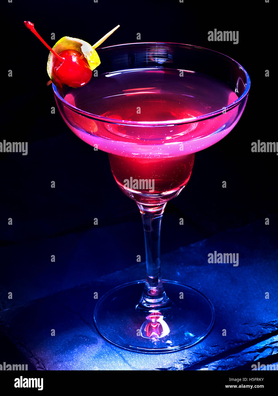 Cherry alcohol cocktail on black background Stock Photo - Alamy