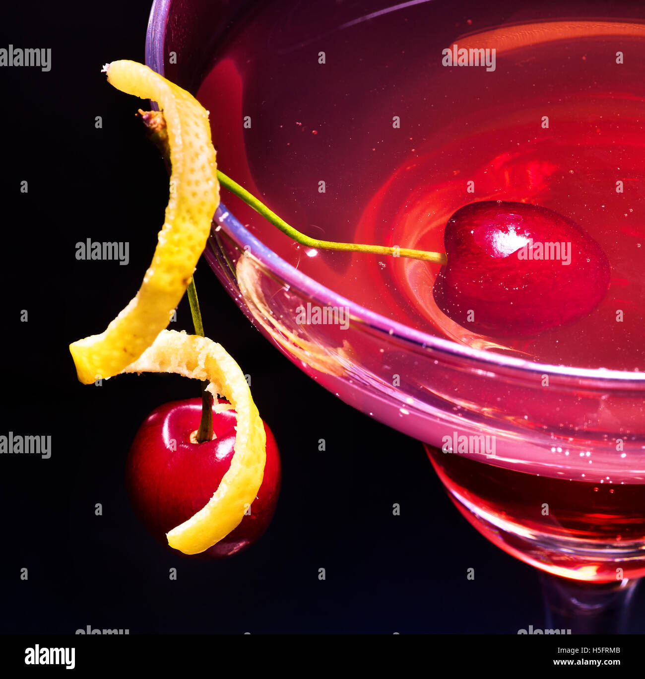Cherry cocktail with lemon slice Stock Photo - Alamy