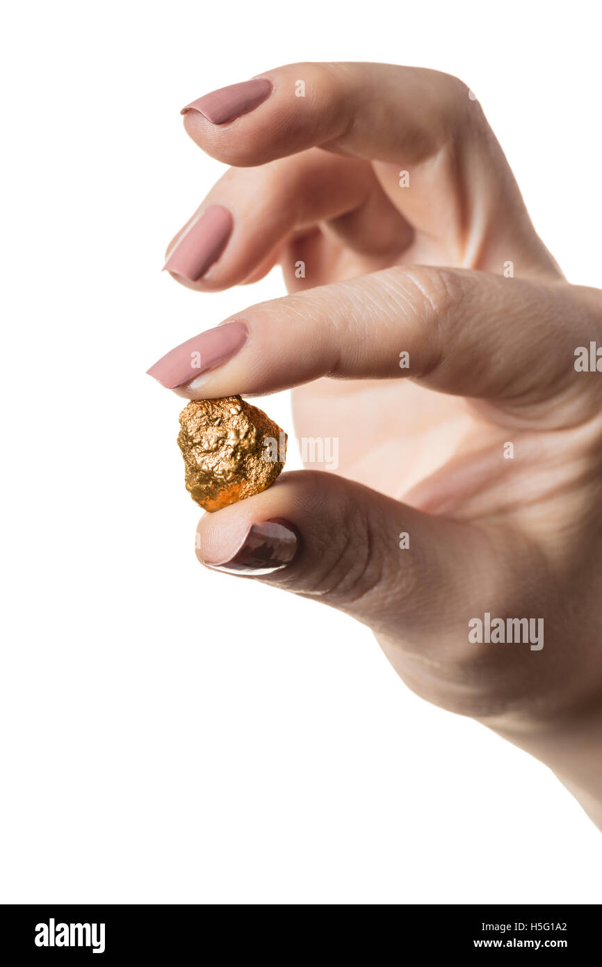 gold nugget in hand on a white background isolated Stock Photo - Alamy