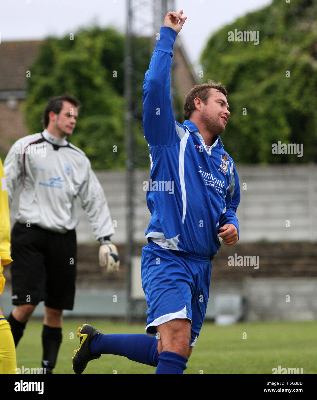 Wayne Vaughan of Aveley scores his side's second goal and celebrates ...