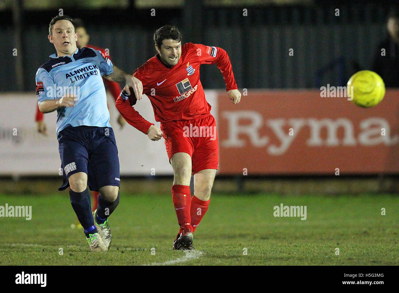 Gary Henty of Redbridge clears from Chas Liddiard of Barkingside ...