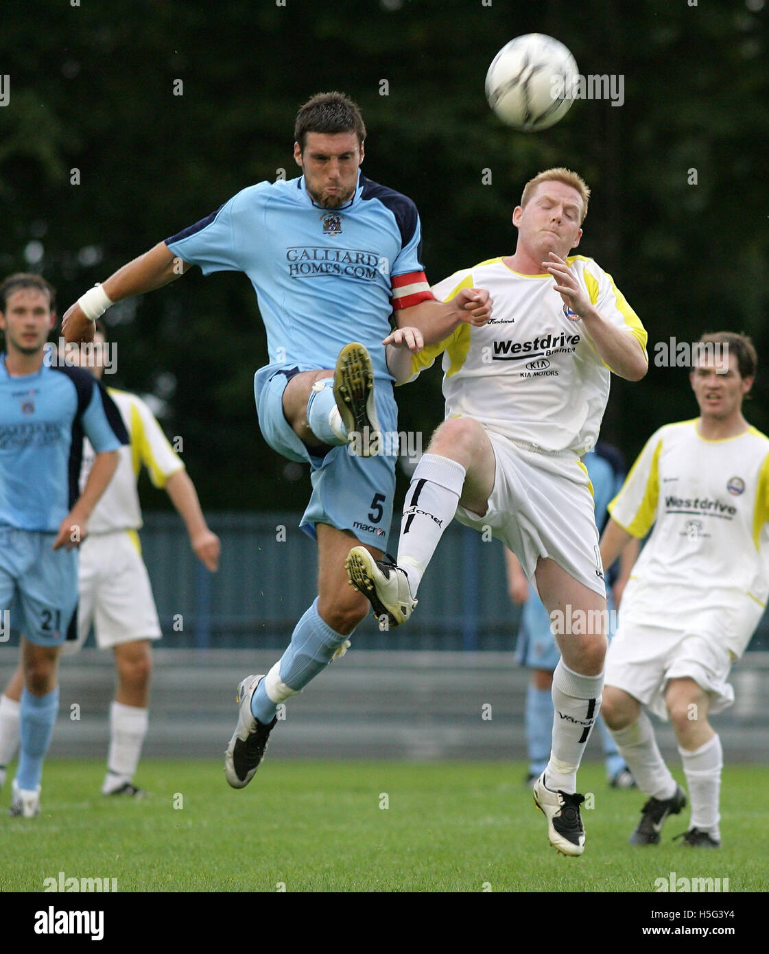 Jon Ashton of Grays (left) clears from Gareth Williams - Braintree Town ...