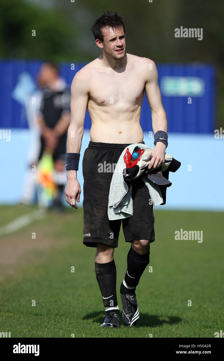 Redbridge goalkeeper Robert Budd leaves the pitch after picking up an ...
