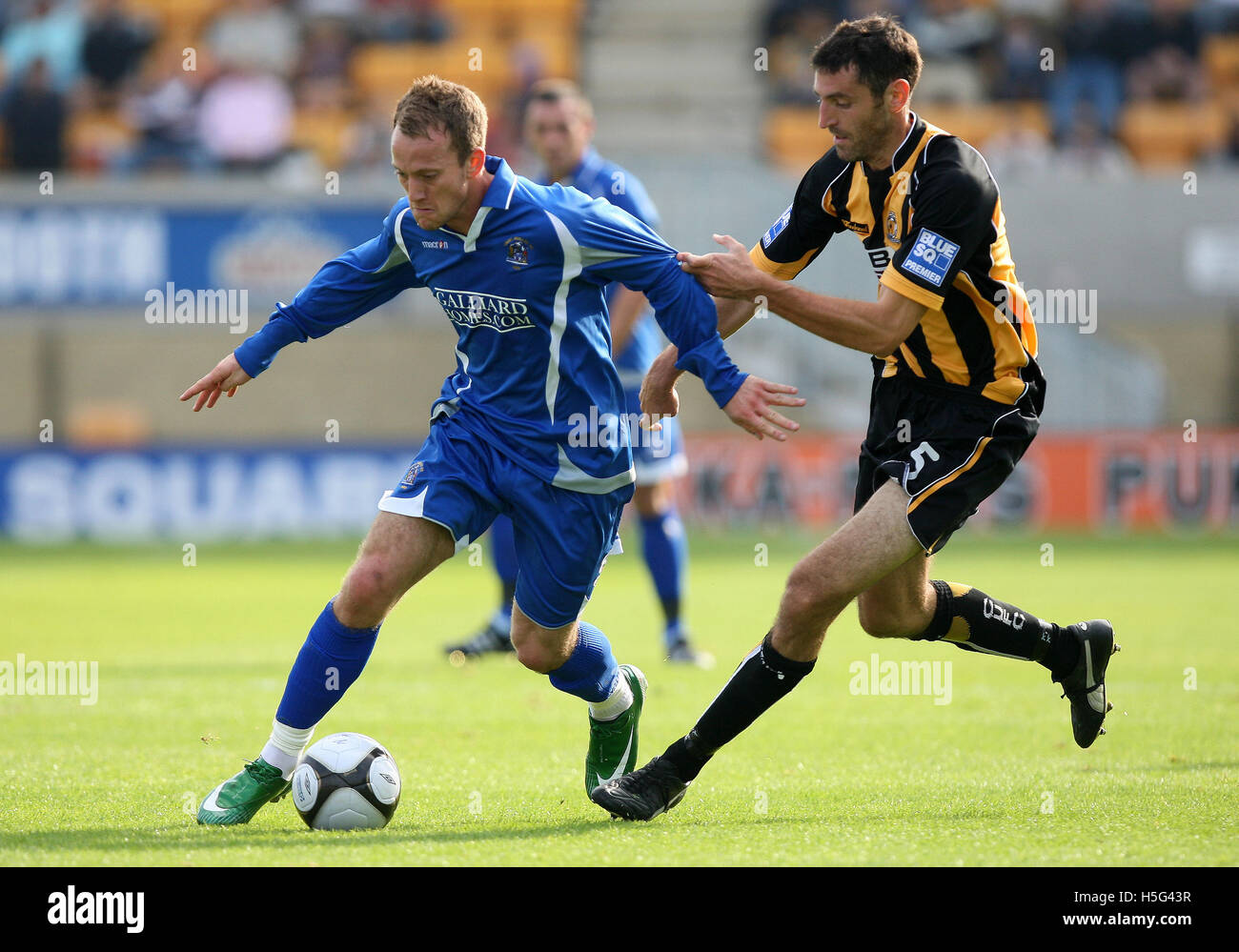 Sean Rigg of Grays tries to round Phillip Bolland of Cambridge ...