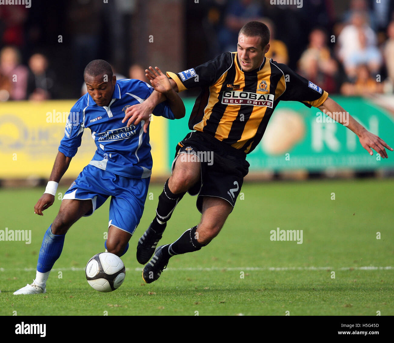 Dan Gleeson of Cambridge challenges Ishmael Welsh - Cambridge United vs ...
