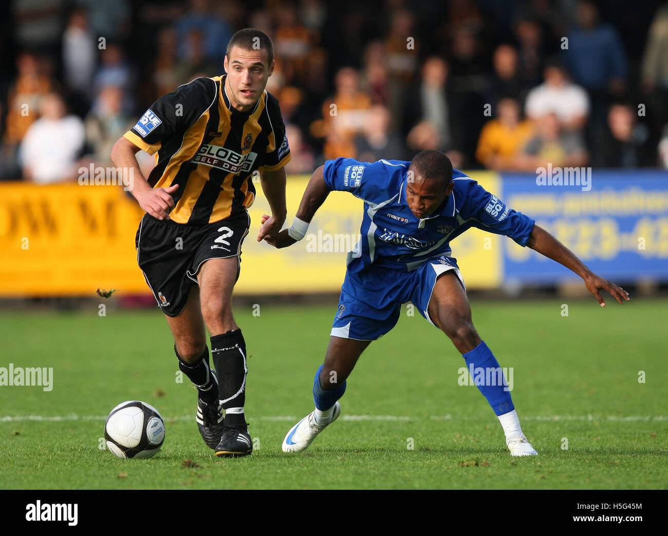 Dan Gleeson of Cambridge brings the ball away from Ishmael Welsh ...